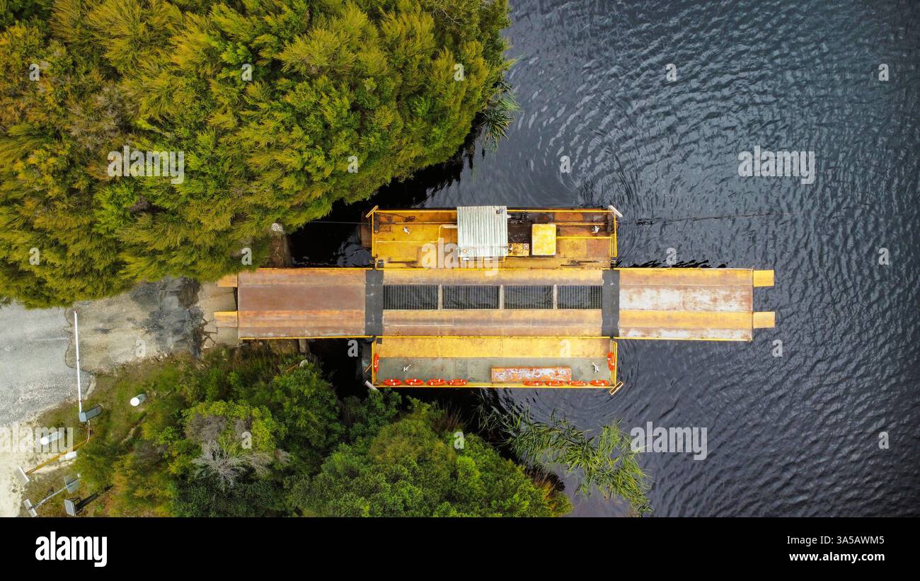 Small ferry on a river in Tasmania, seen from above Stock Photo - Alamy