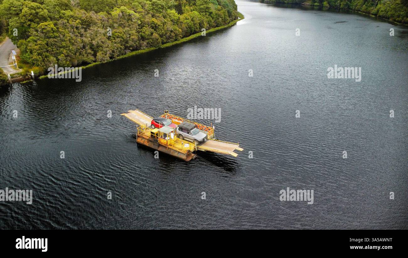 Small ferry on a river in Tasmania, seen from above Stock Photo - Alamy