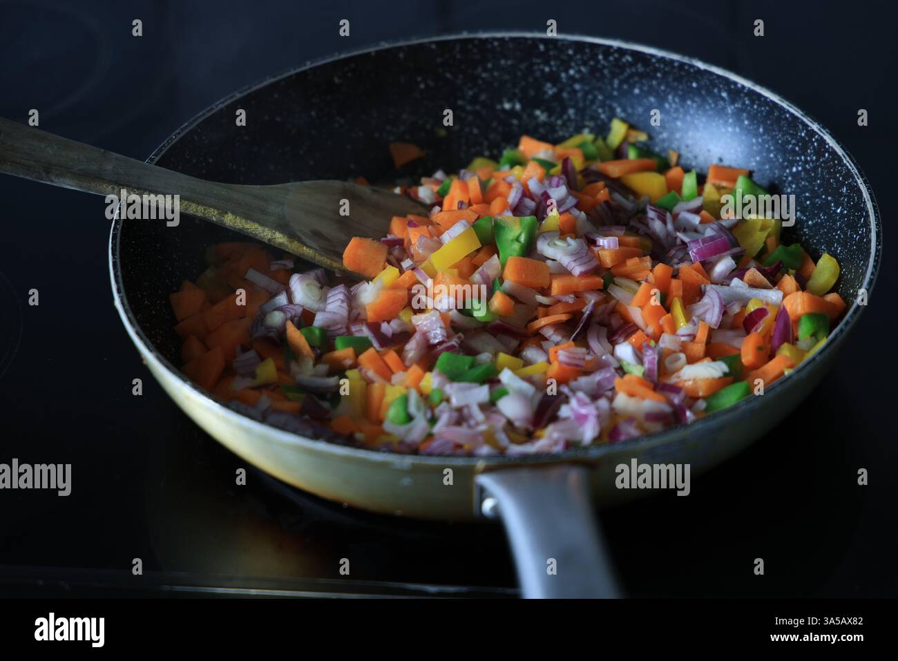 Close up frying vegetables in hi-res stock photography and images - Alamy