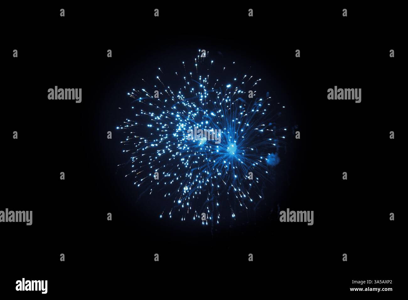 Single Blue Firework Burst Against Night Sky Stock Photo - Alamy