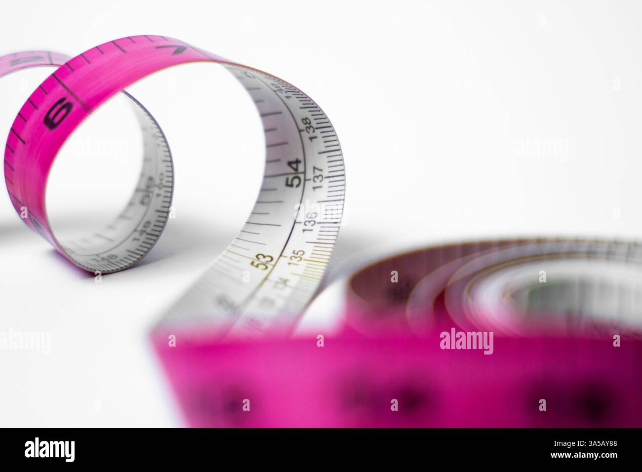 A detailed close-up shot of a measuring tape, showcasing its inch and ...