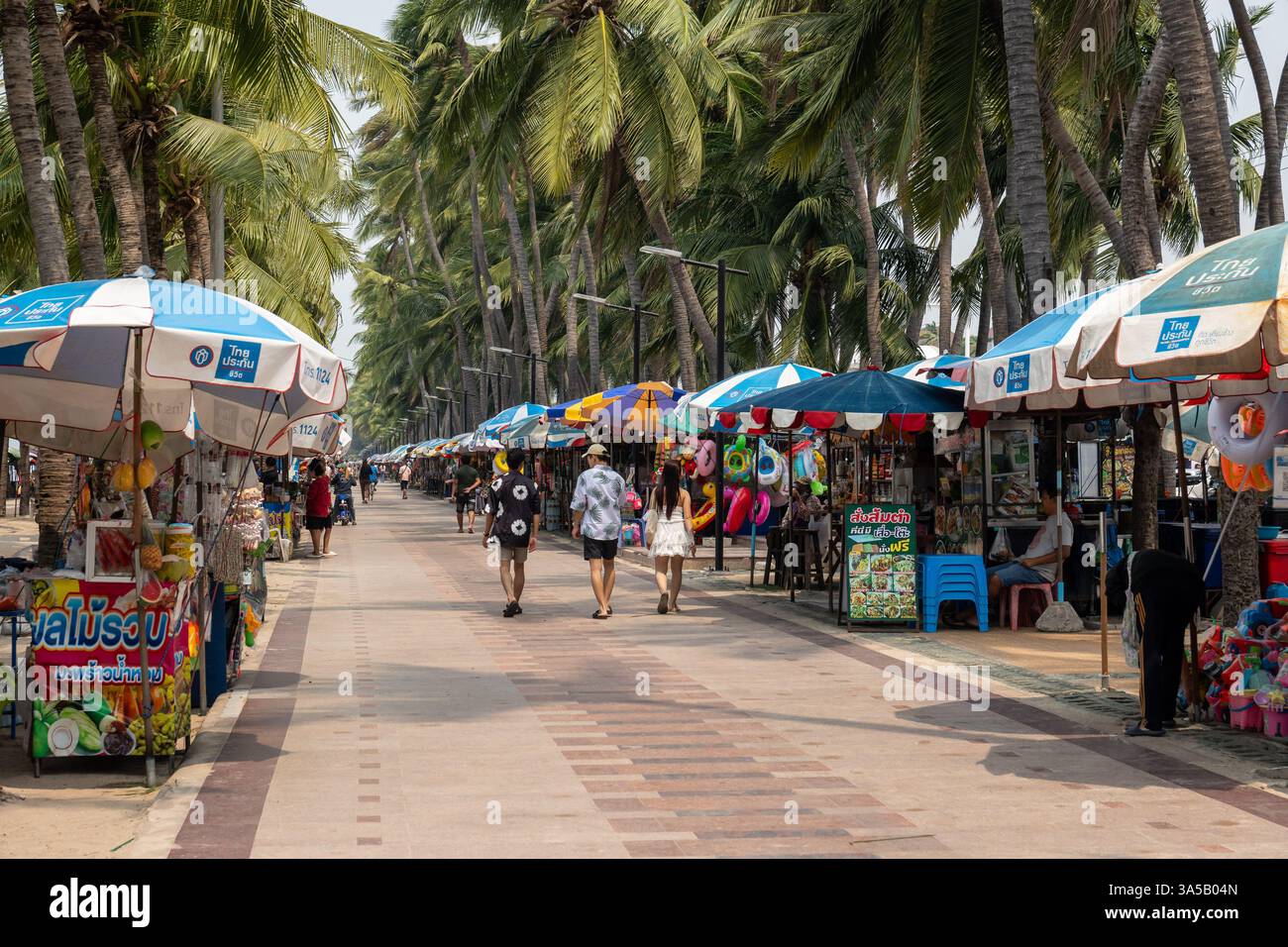 Visitors seen walking through the alley of the street food stalls at ...