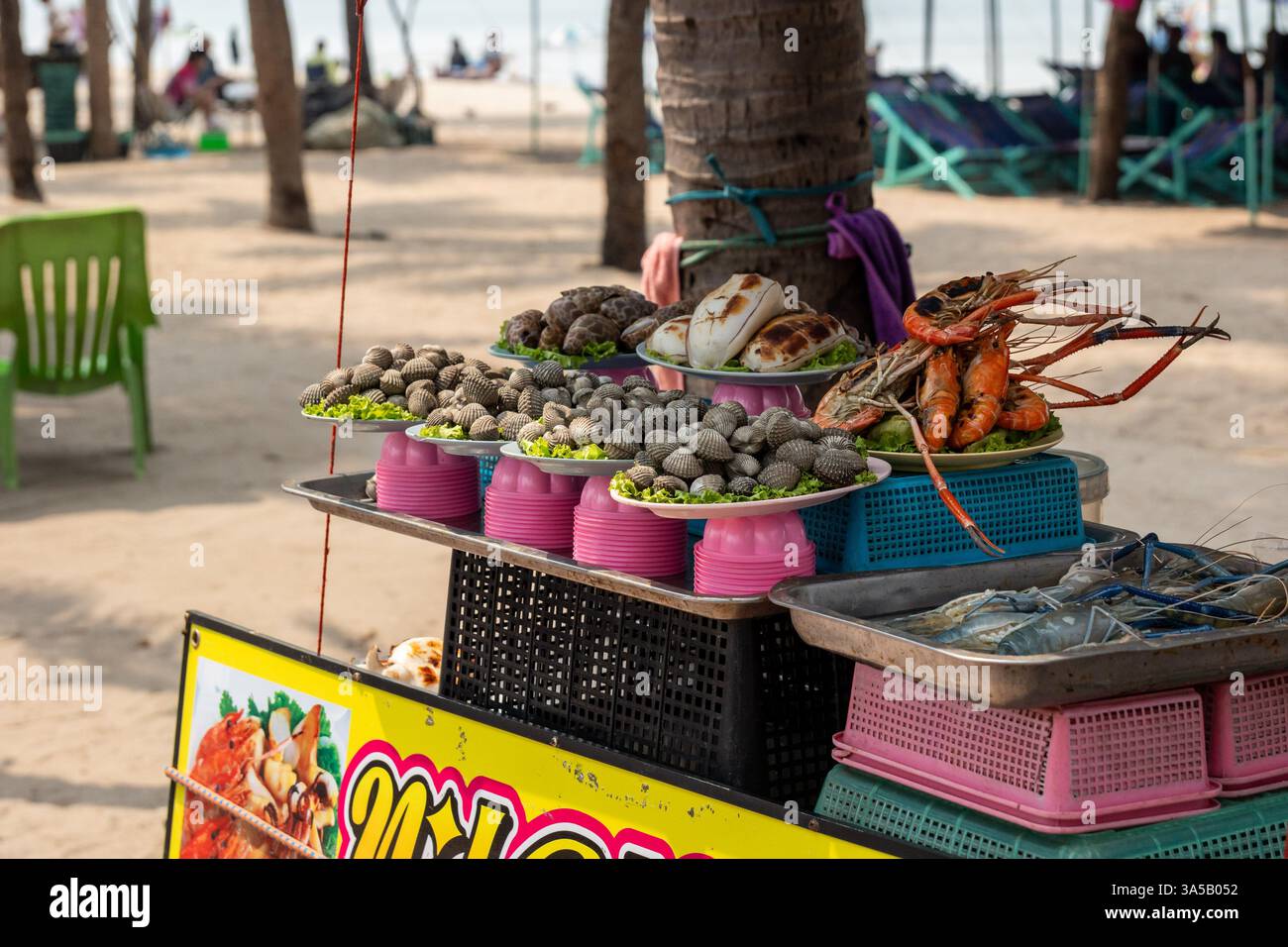 A close-up of various seafood ready to eat at a street food stall at ...