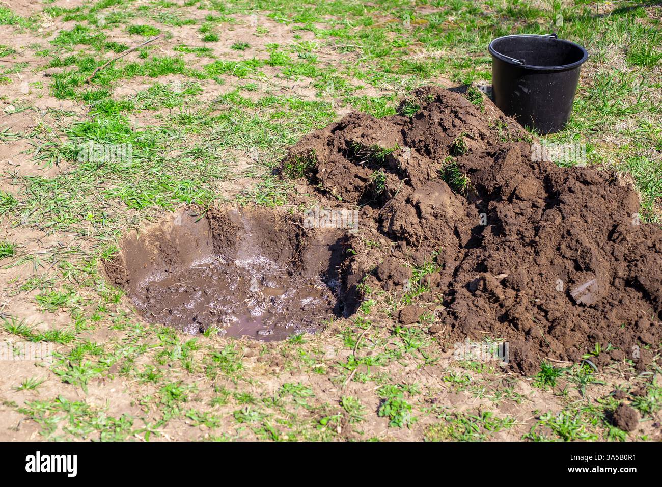 Water poured hole in soil hi-res stock photography and images - Alamy