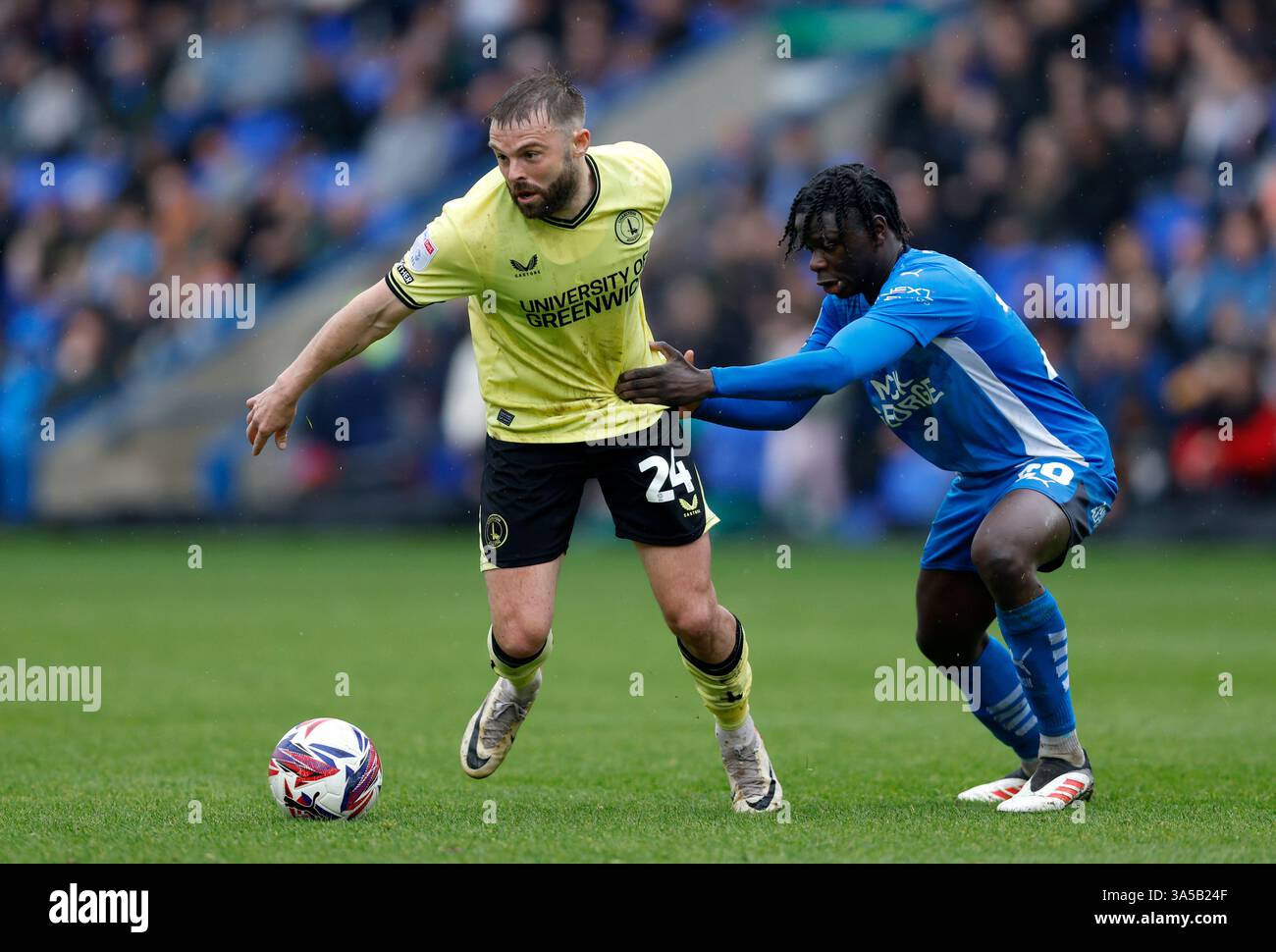 Charlton Athletic's Matt Godden (left) and Peterborough United's ...