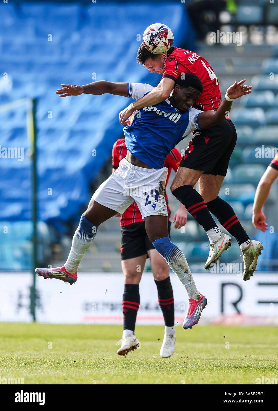 Gillingham Joseph Gbode and Walsall Oisin McEntee in action during the ...