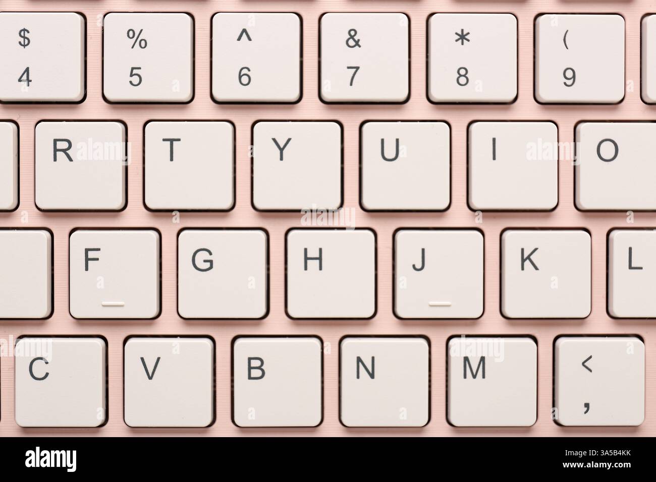 Pink computer keyboard as background. Closeup Stock Photo - Alamy