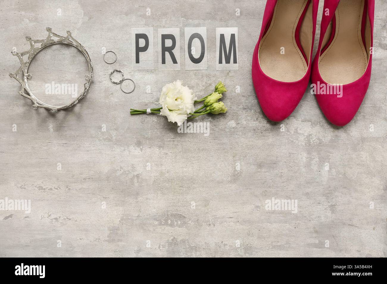 Word PROM with female shoes, crown and boutonniere on grey grunge ...