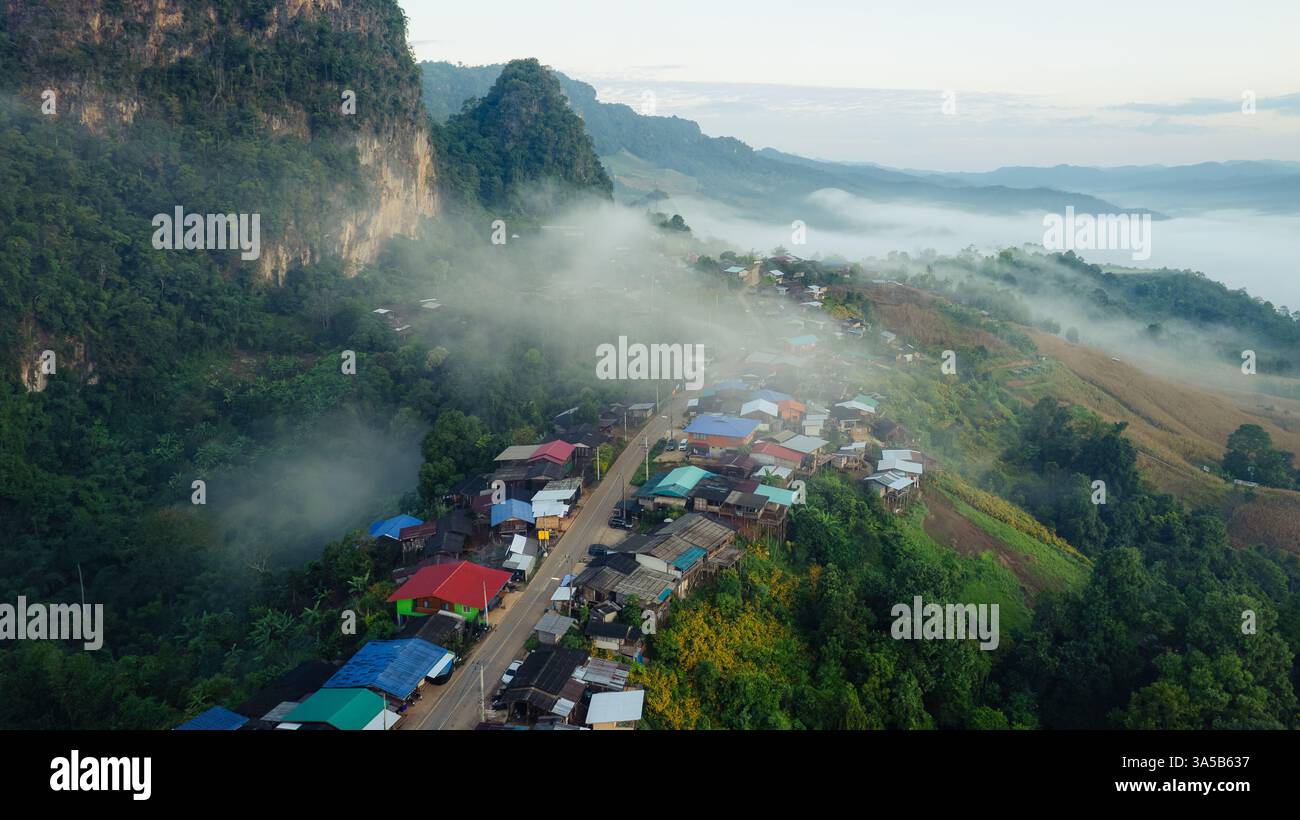 Aerial view of Traditional local village of Ban Jabo with foggy and ...