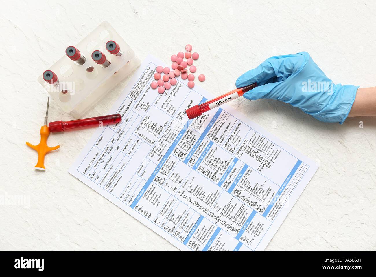 Doctor with HIV blood test tubes, pills and laboratory report form on ...