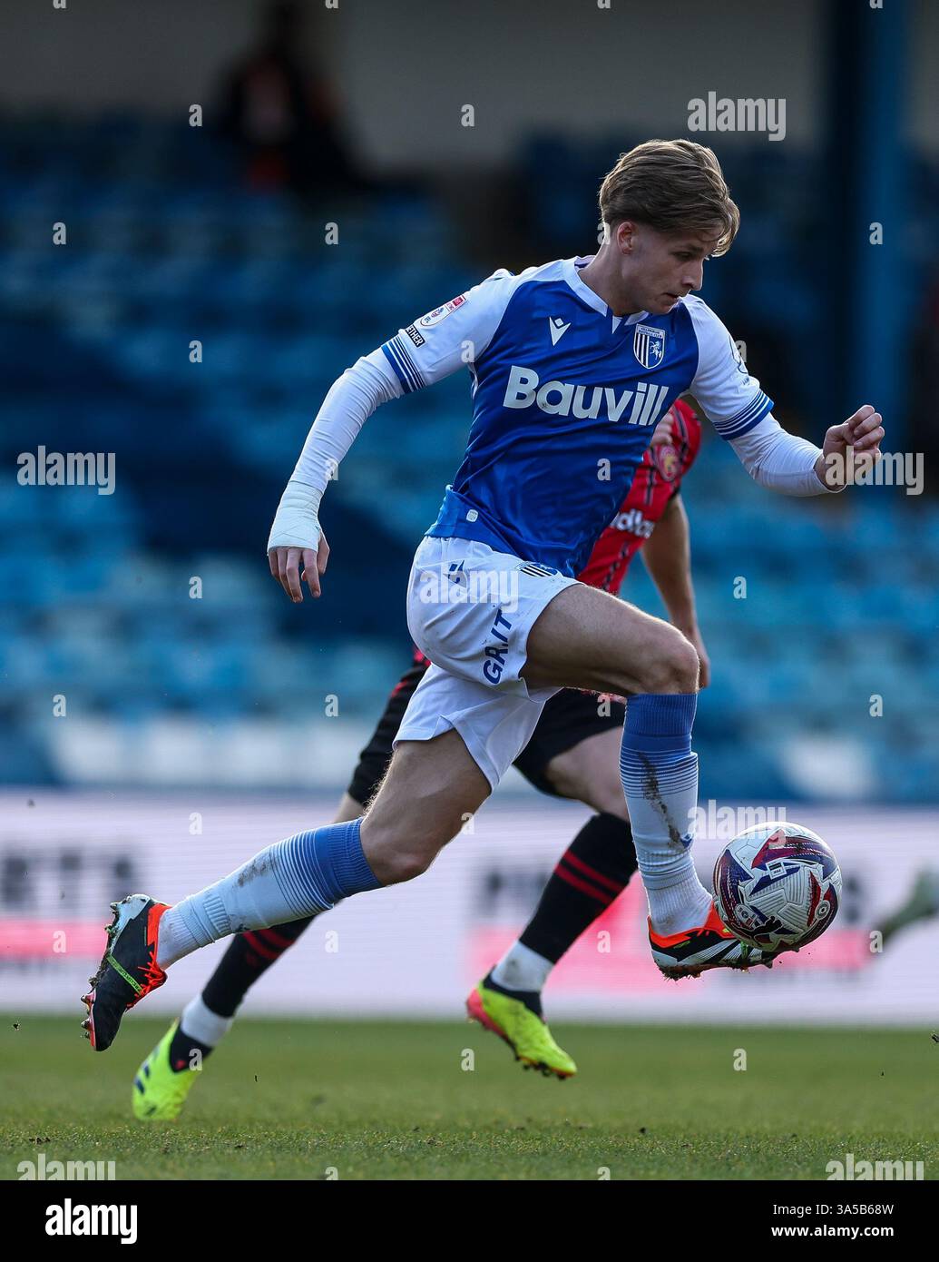 Gillingham Jimmy-Jay Morgan and Walsall Ryan Stirk in action during the ...