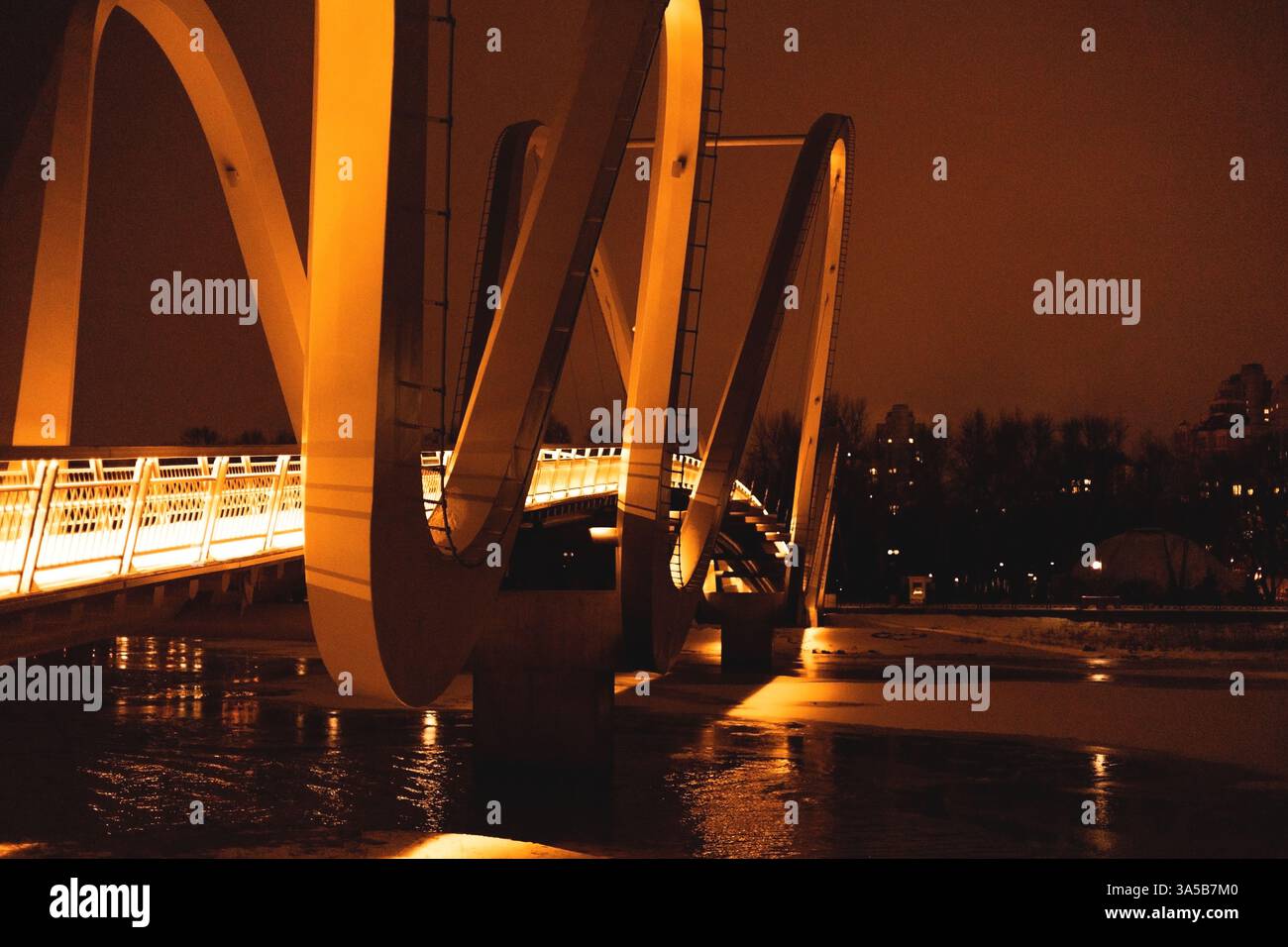 glowing pedestrian bridge at night Stock Photo - Alamy