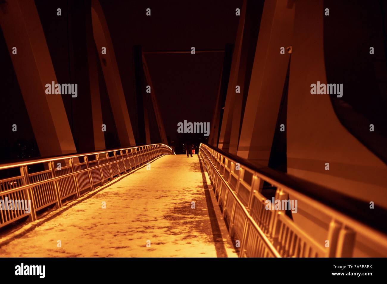 glowing pedestrian bridge at night Stock Photo - Alamy