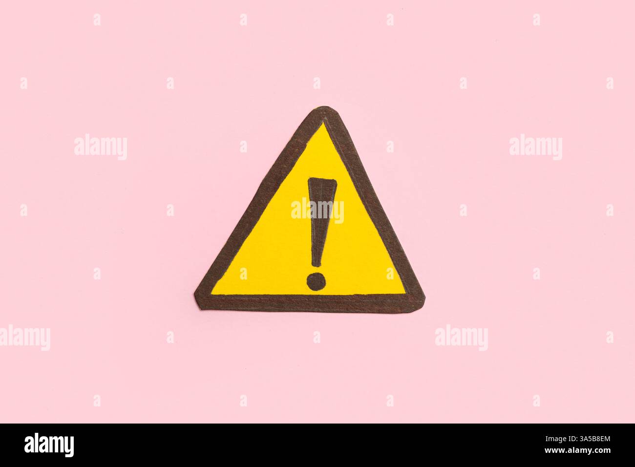 Yellow triangle with exclamation mark on pink background Stock Photo ...
