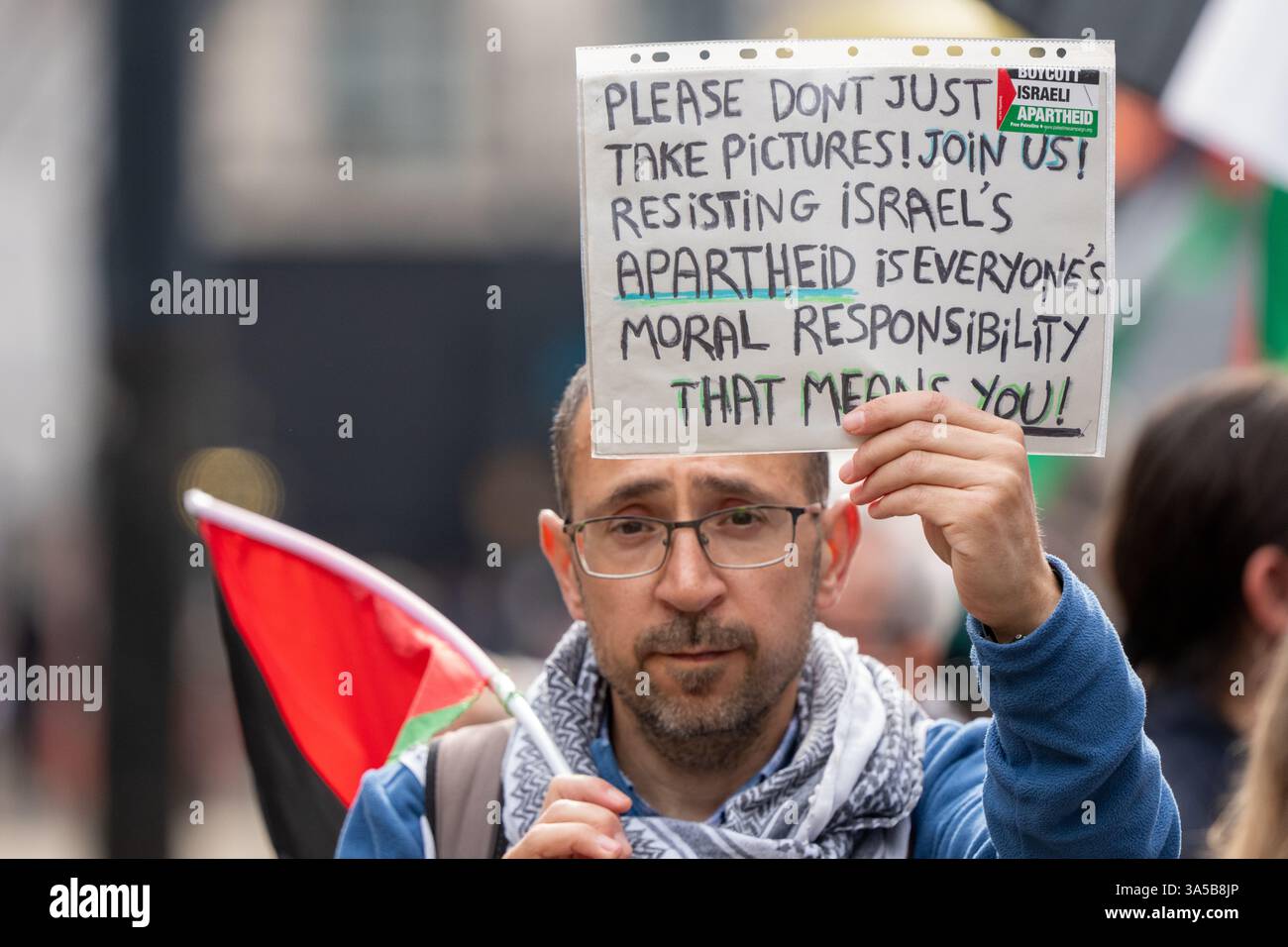 A single counter protester carrying an English flag marked with 'Free ...