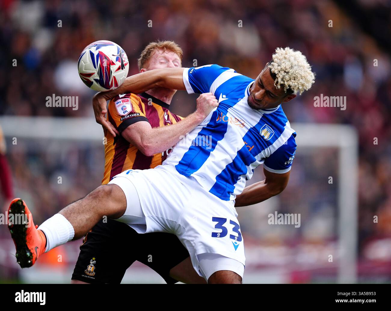 Colchester United's Lyle Taylor and Bradford City's Bradley Halliday ...