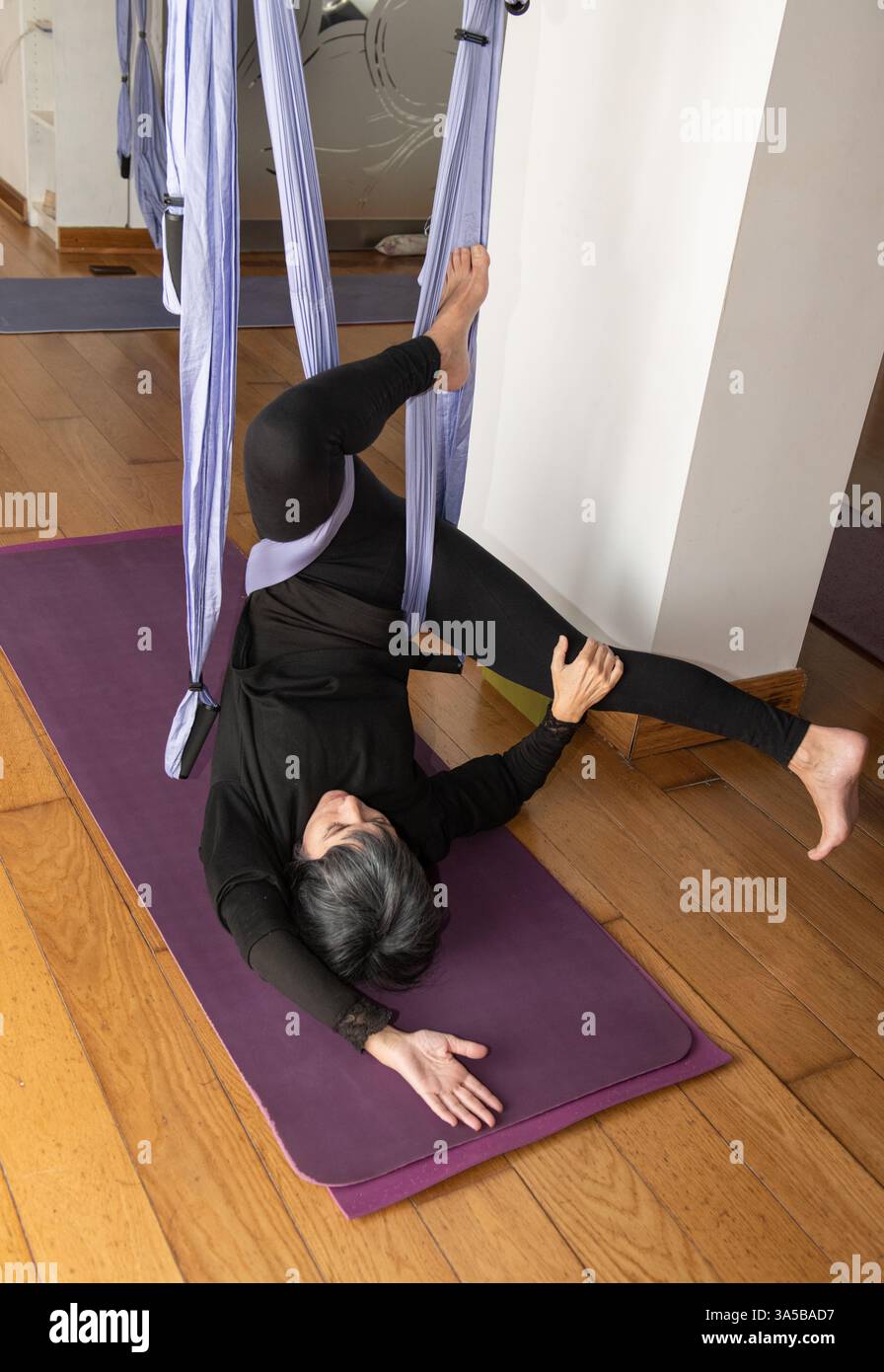 Aerial yoga female group hi-res stock photography and images - Alamy