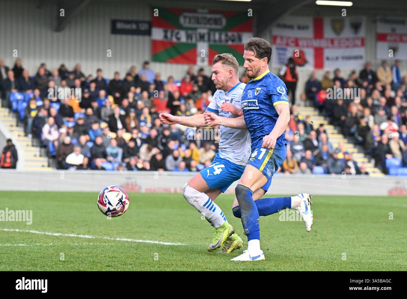 Ben Whitfield (34 Barrow) challenged by Sam Hutchinson (41 AFC ...