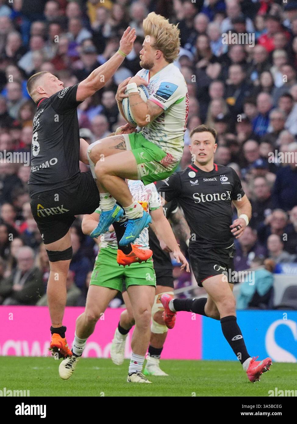Harlequins’ Tyrone Green (centre) catches the ball under pressure from ...