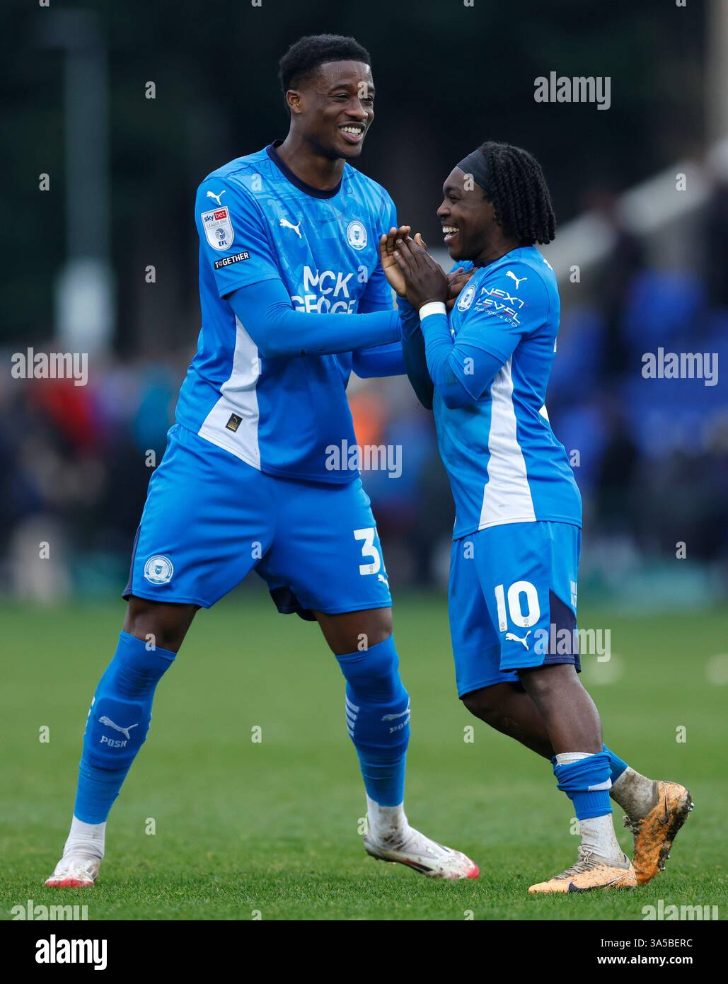 Peterborough United's Emmanuel Fernandez (left) and Abraham Odoh ...