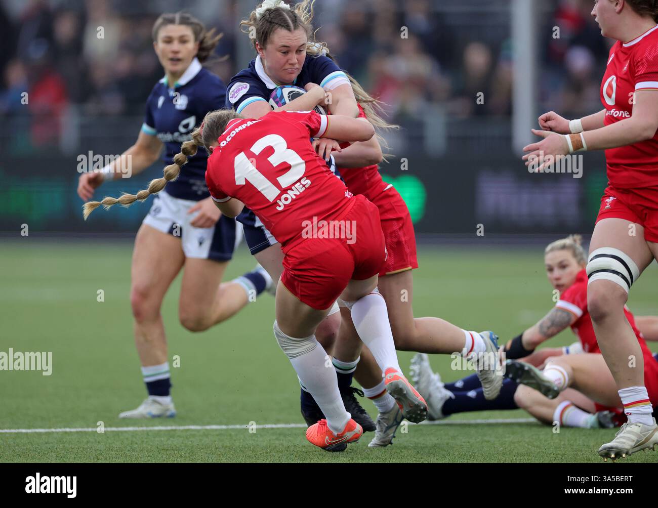 Scotland's Hollie Cunningham is tackled by Wales' Hannah Jones during ...