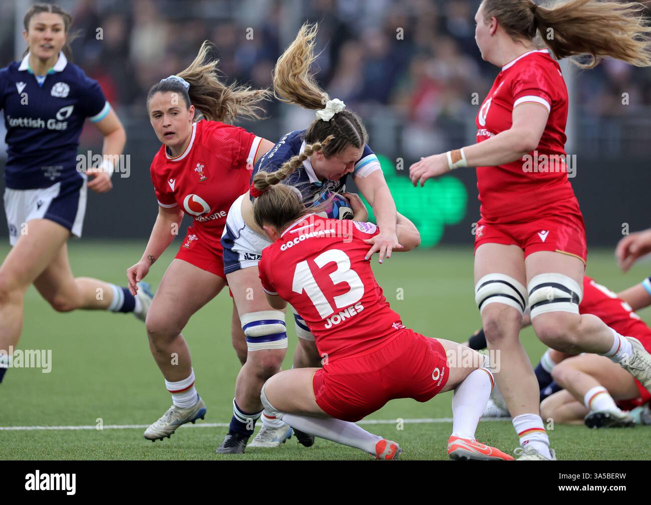 Scotland's Hollie Cunningham is tackled by Wales' Hannah Jones during ...