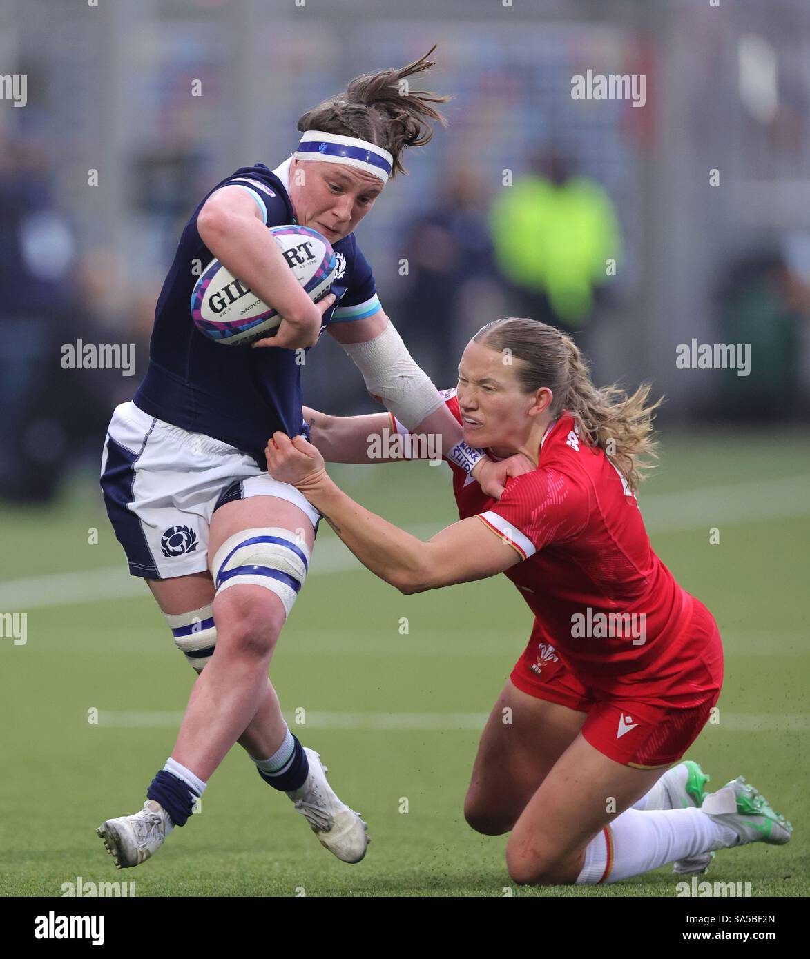 Scotland's Rachel McLachlan is tackled by Wales' Carys Cox during the ...