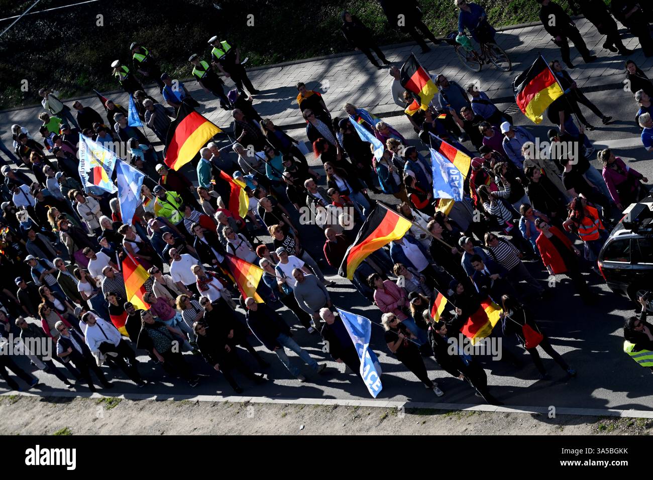 Munich, Germany. 22nd Mar, 2025. Demonstrators march through ...
