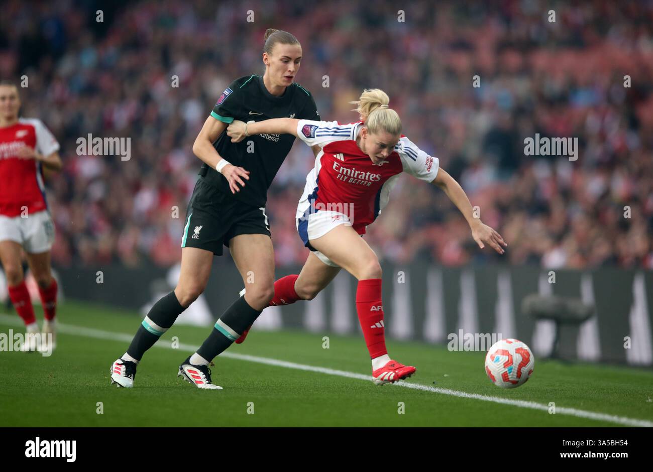 Arsenal's Alessia Russo (right) and Liverpool's Jenna Clark (left ...