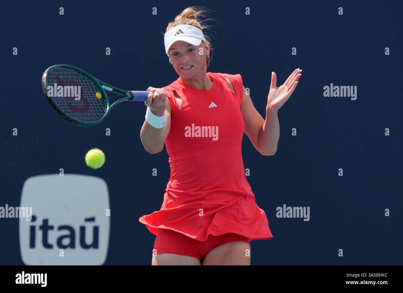 Ashlyn Krueger hits a return to Leyleh Fernandez, of Canada, during the Miami Open tennis ...