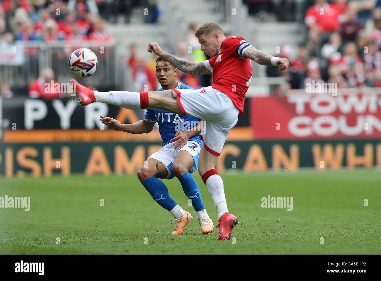 Wrexham, UK. 22nd Mar, 2025. James McClean of Wrexham clears the ball ...