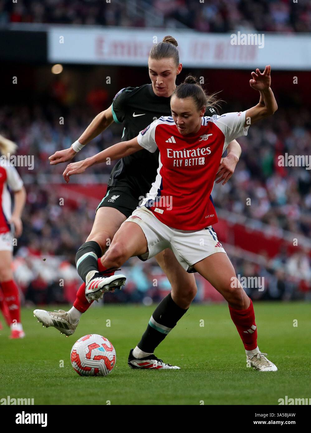 Liverpool's Jenna Clark (left) and Arsenal's Caitlin Foord (right ...