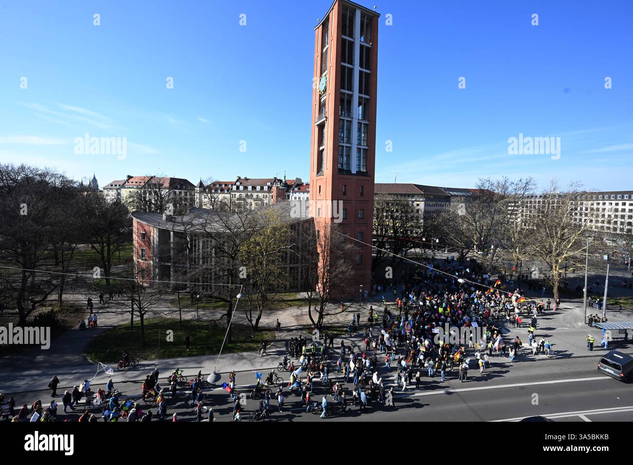 Munich, Germany. 22nd Mar, 2025. Demonstrators walk across Sendlinger ...