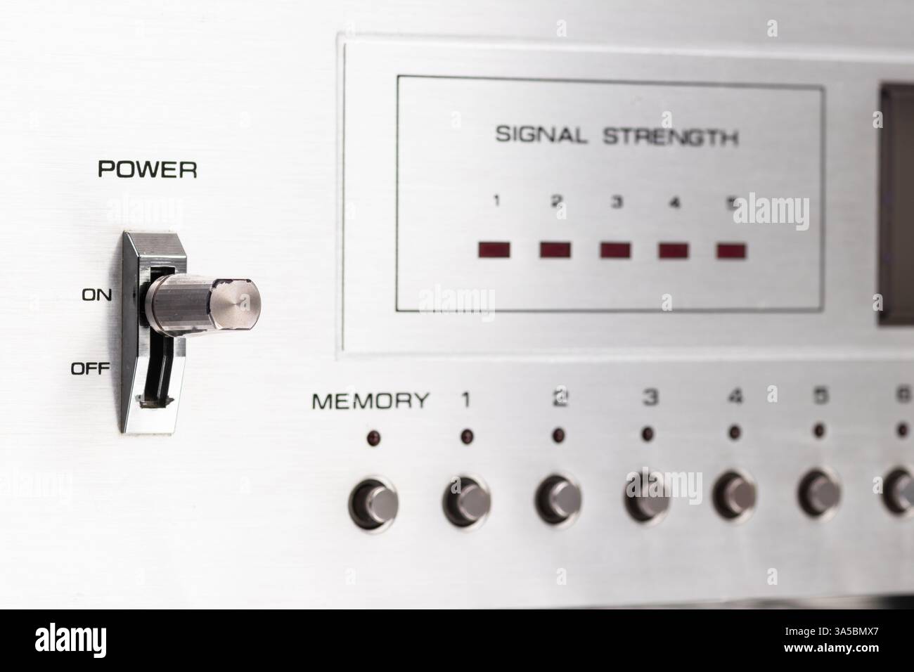 Close-up of a classic audio component showcasing details of its knobs ...