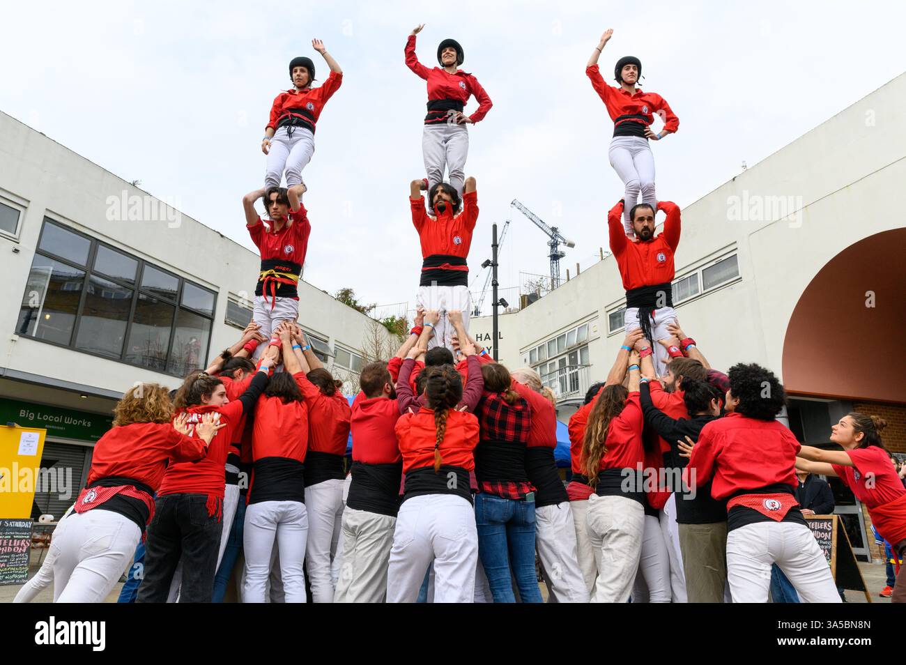 London, UK. 22 March 2025. Castellers of London build a human tower ...