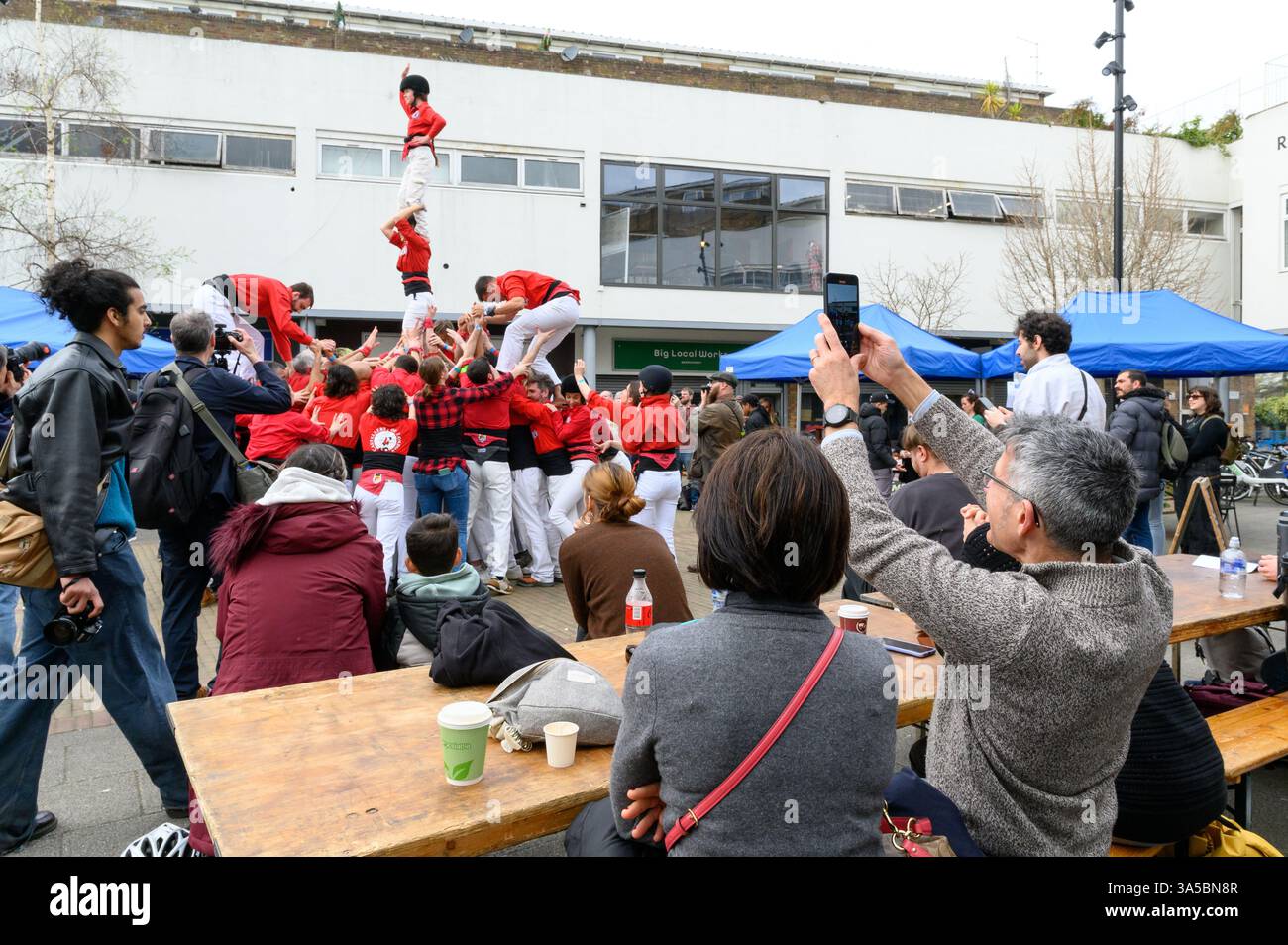 London, UK. 22 March 2025. Castellers of London build a human tower ...