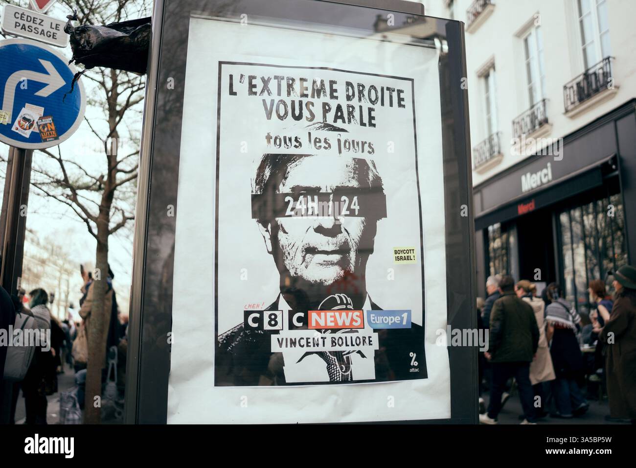 This photo shows a poster with a portrait of Vincent Bollore and the ...