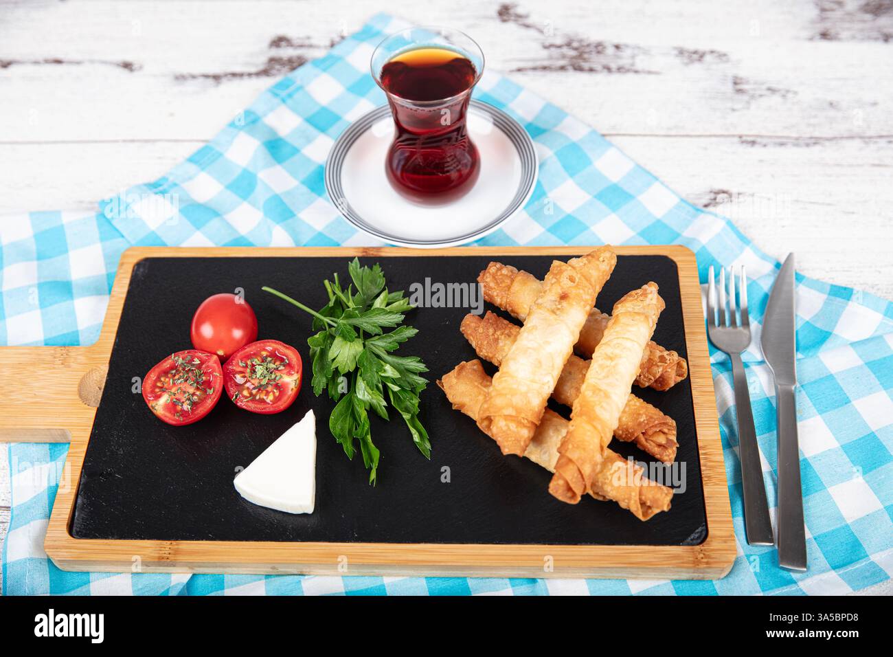 Cigarette pastry. Cheese pie on wood floor. Fried cheese rolls with ...