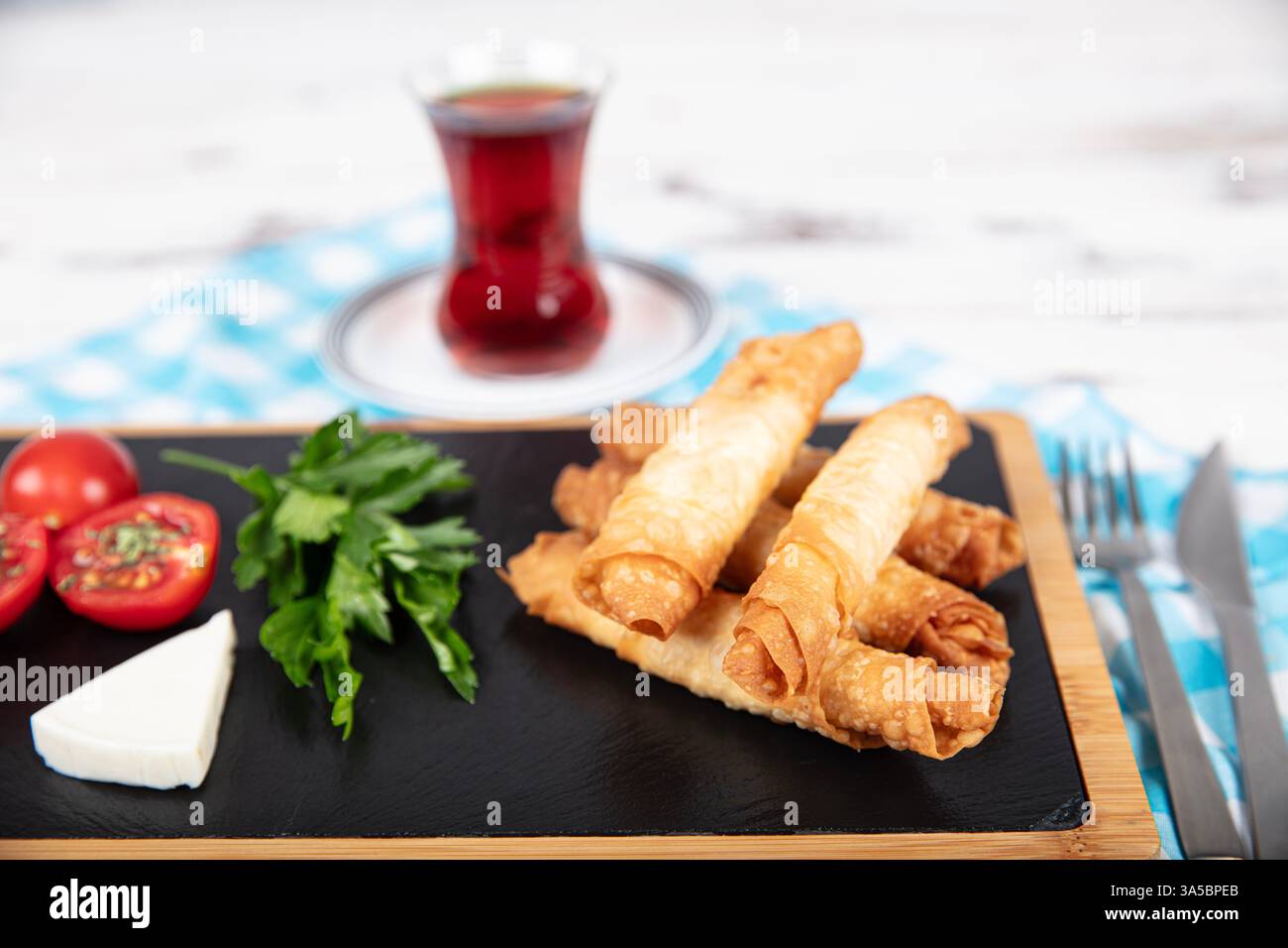 Cigarette pastry. Cheese pie on wood floor. Fried cheese rolls with ...