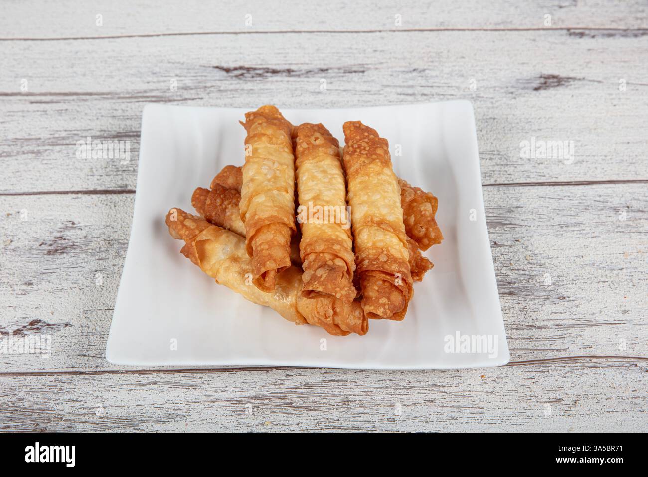 Cigarette pastry. Cheese pie on wood floor. Fried cheese rolls with ...