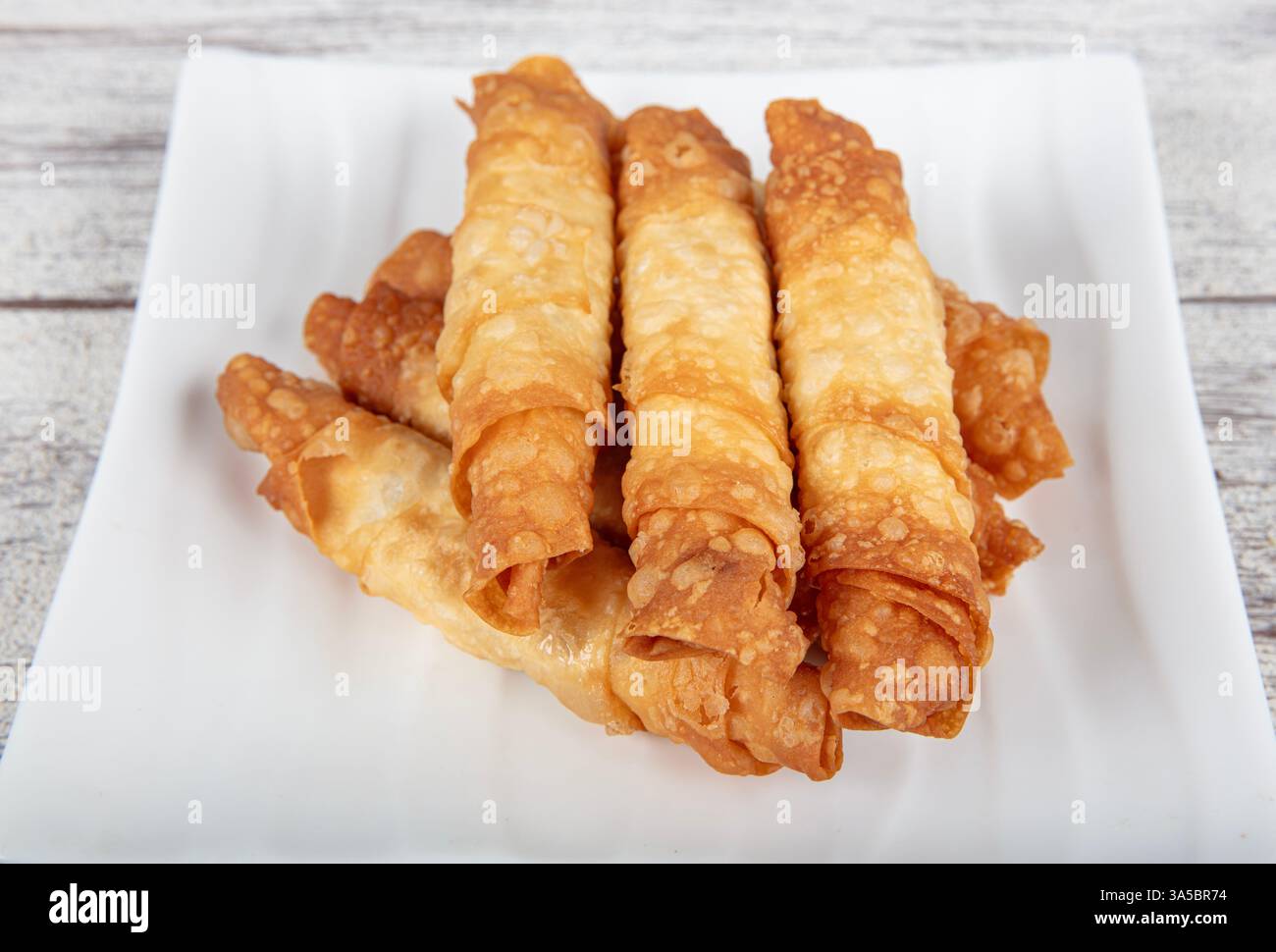 Cigarette pastry. Cheese pie on wood floor. Fried cheese rolls with ...