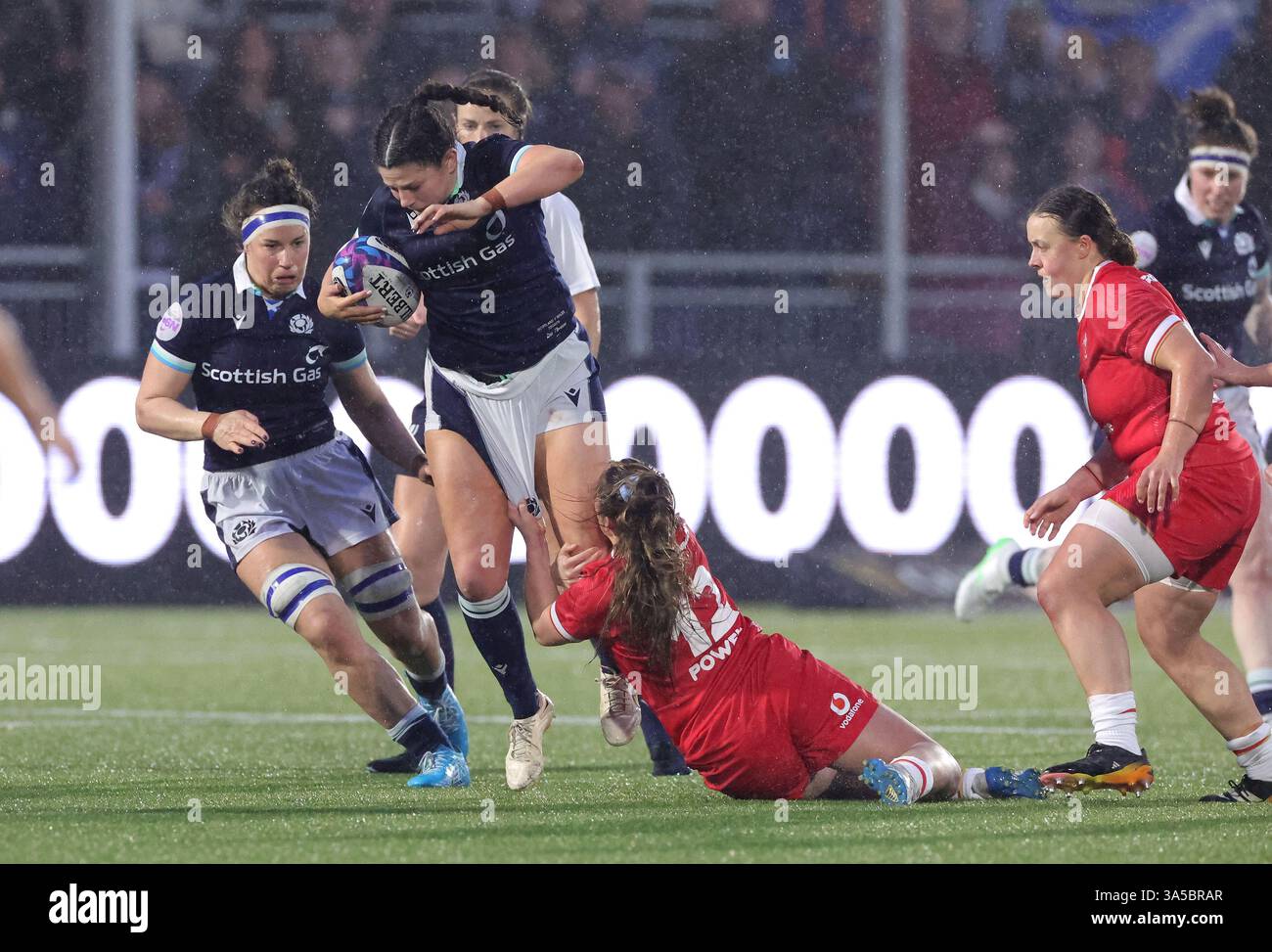 Scotland's Lisa Thomson is tackled by Wales' Kayleigh Powell during the ...