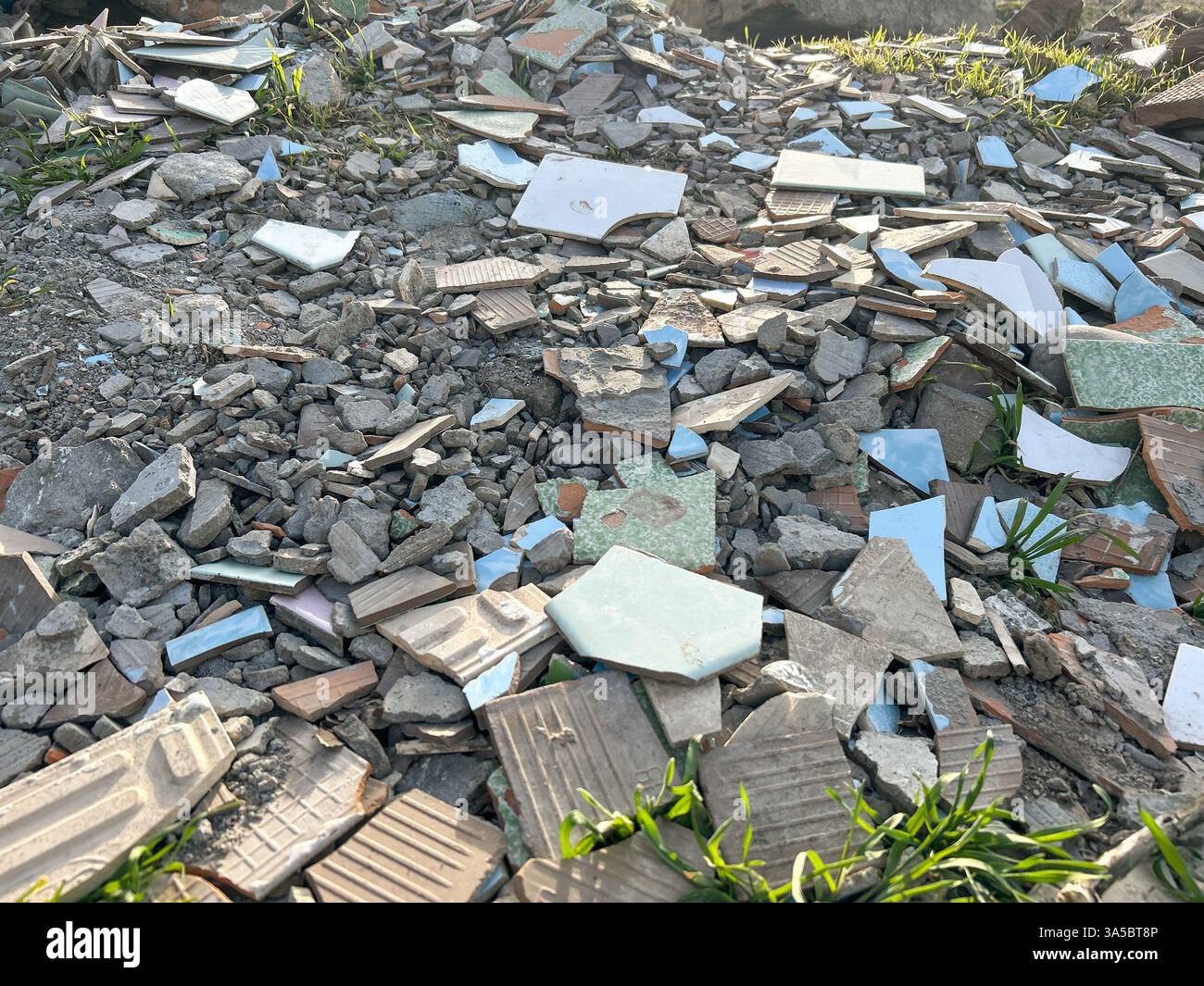 a pile of old broken blue tiles Stock Photo - Alamy