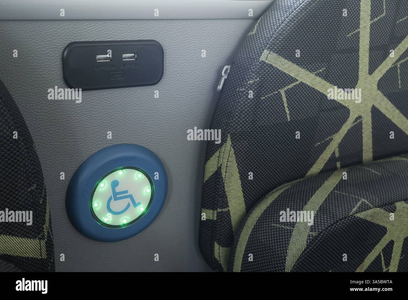 Reserved seat for wheelchairs inside a bus Stock Photo - Alamy