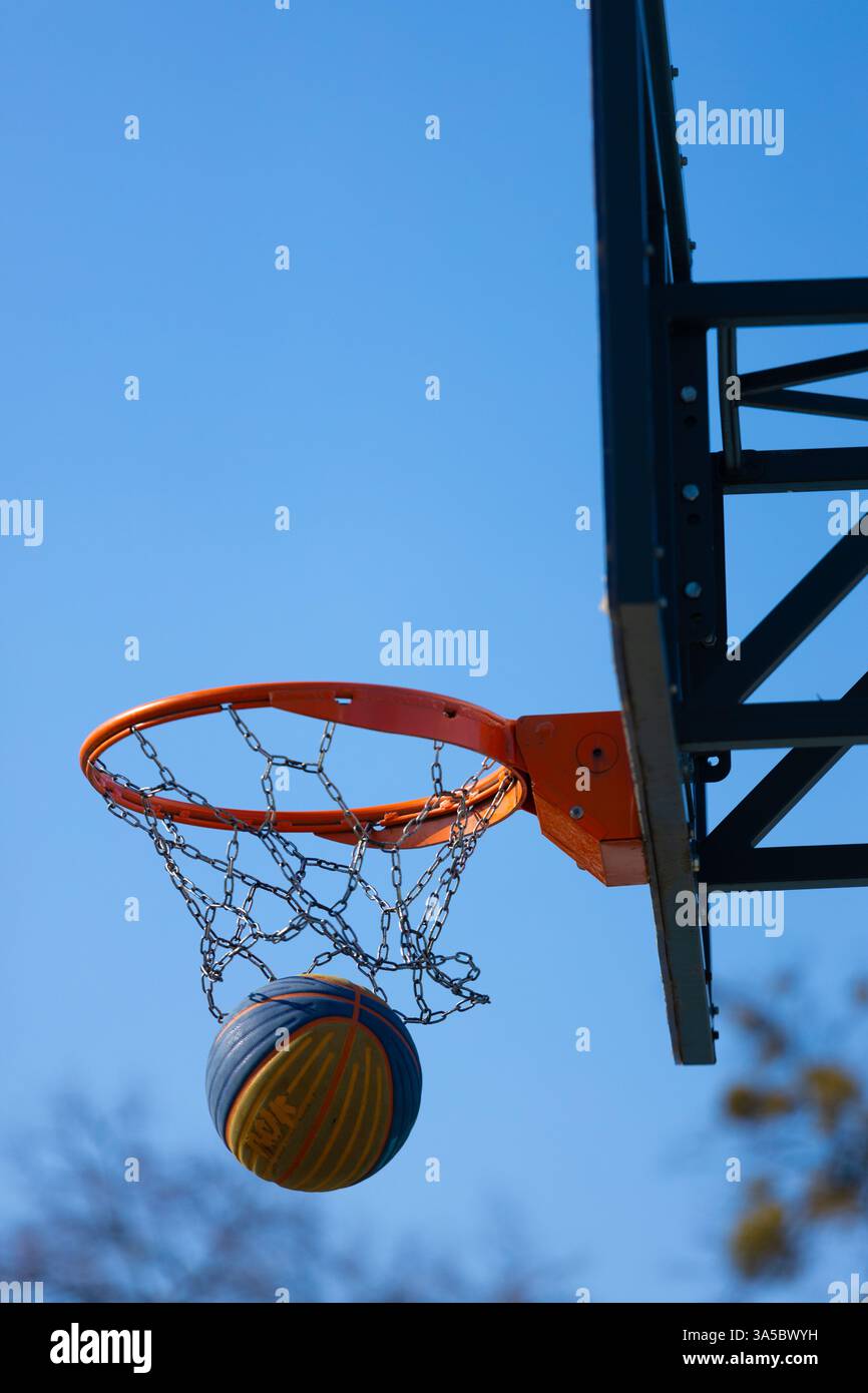 Basketball in Mid Air: Capturing the Moment of a Ball Going Through the ...
