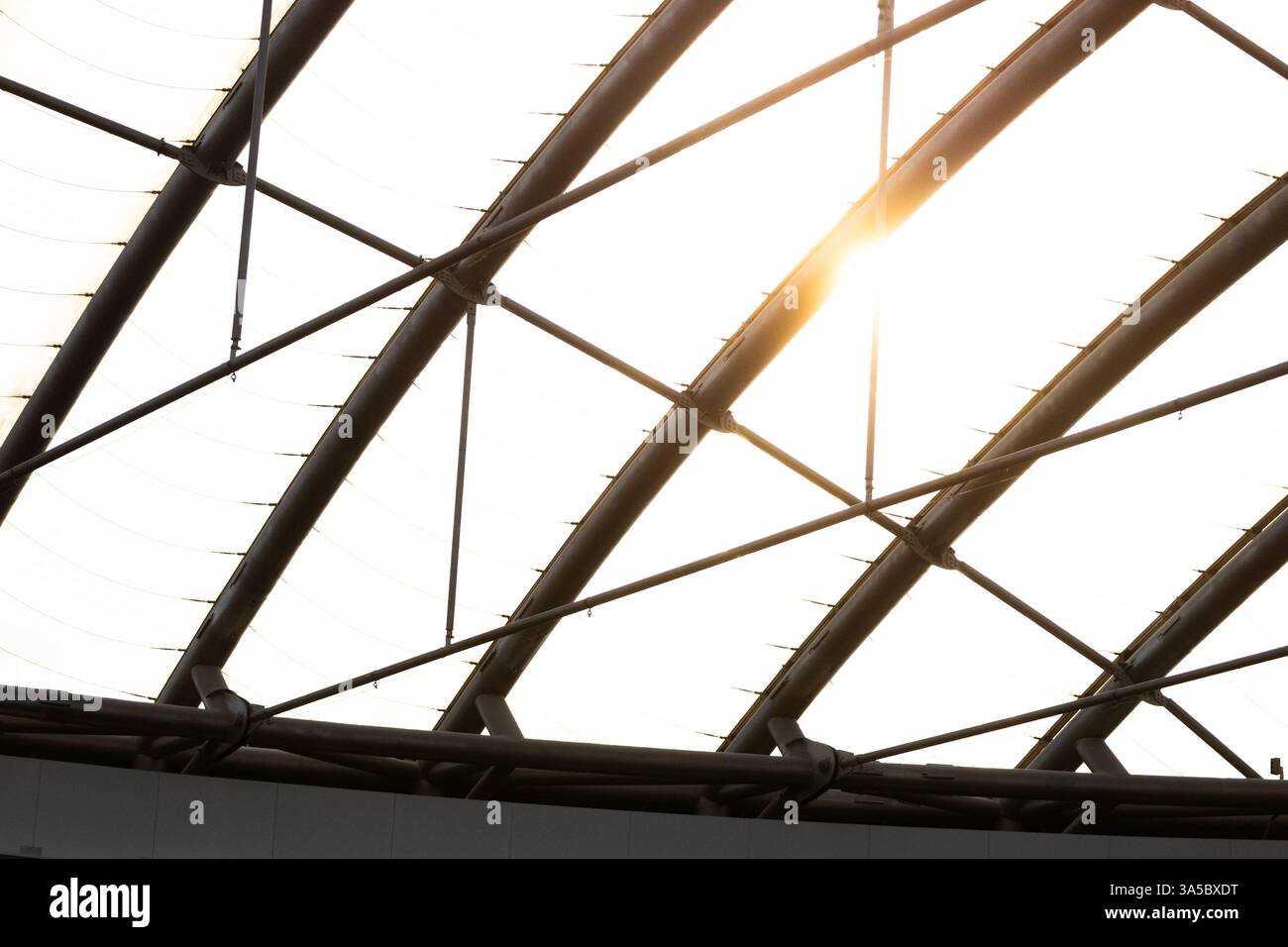 A Modern Architectural Marvel with Striking Framework Capturing Sunlight Through Its Transparent ...