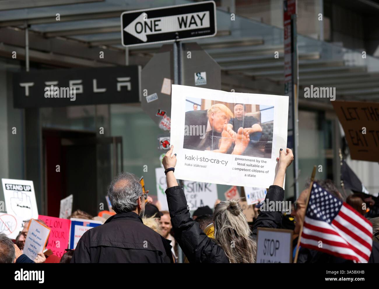 Protesters hold signs and American Flags when they gather outside of ...