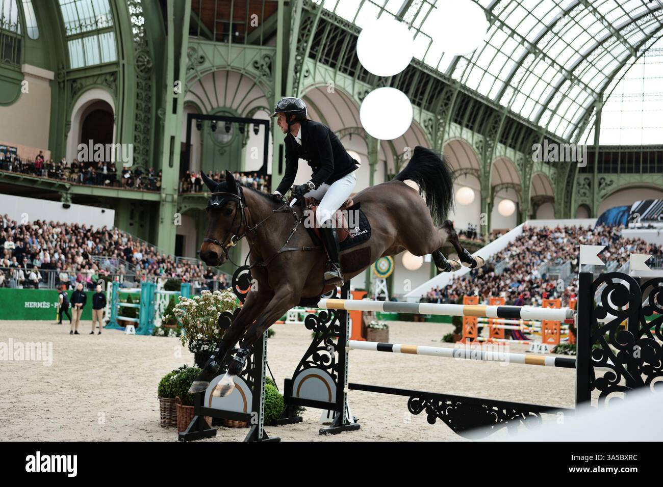 Martin FUCHS of Switzerland with Commissar pezi during the Saut Hermès at the Saut Hermès on ...