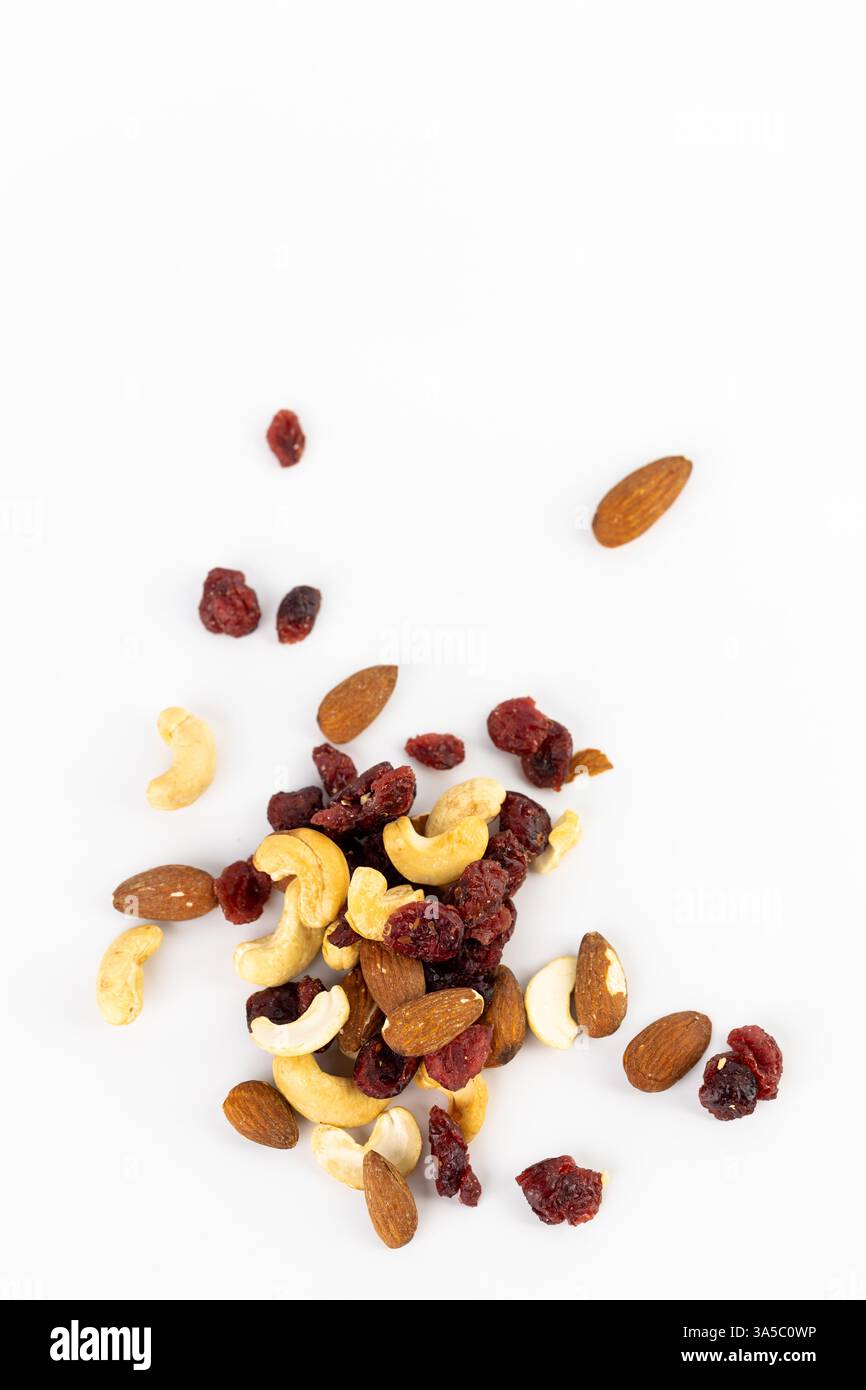 top shot on white background a pile of different kinds of nuts is ...