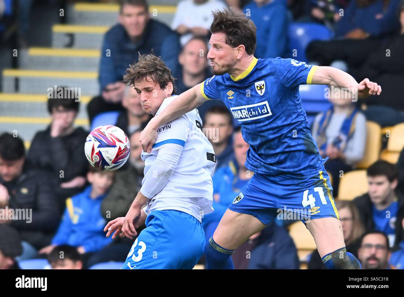Aaron Pressley (33 Barrow) and Sam Hutchinson (41 AFC Wimbledon) battle ...
